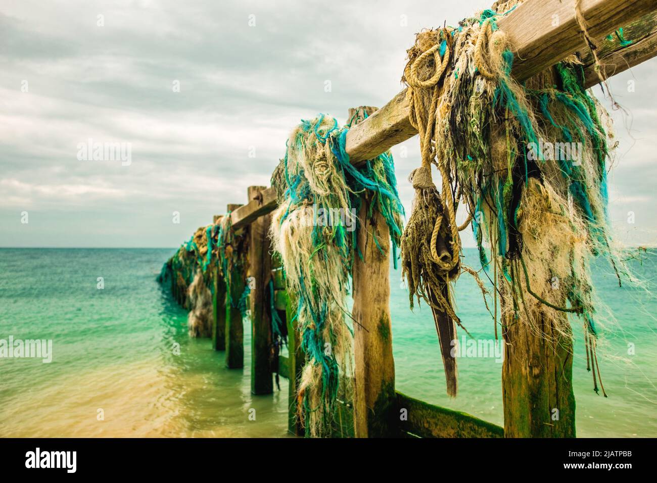 Old ropes and netting on a breaker, Seven Sisters, East Sussex, England ...