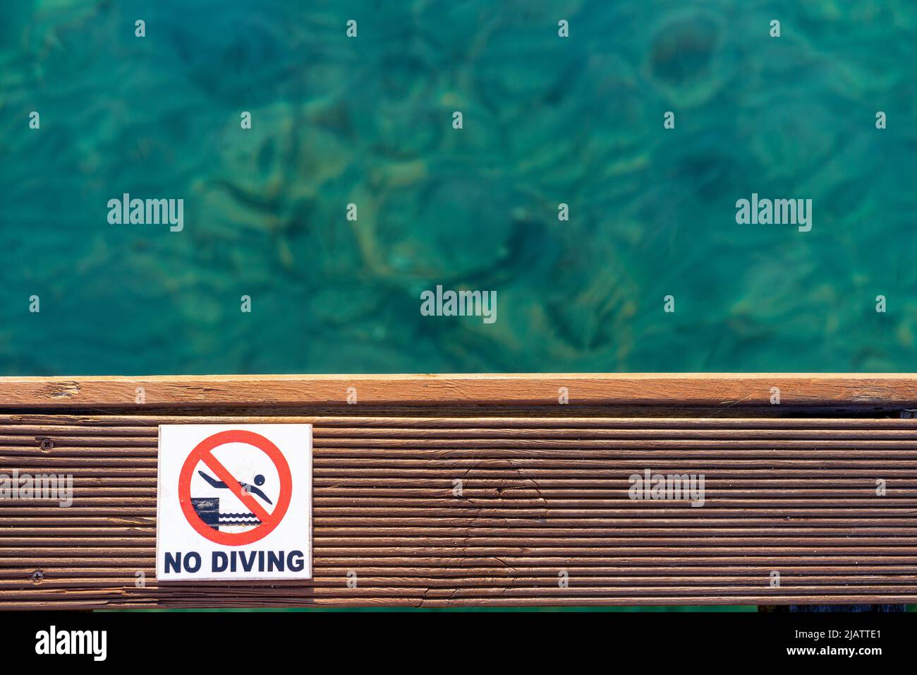 No diving sign at the beach with copy space Stock Photo - Alamy