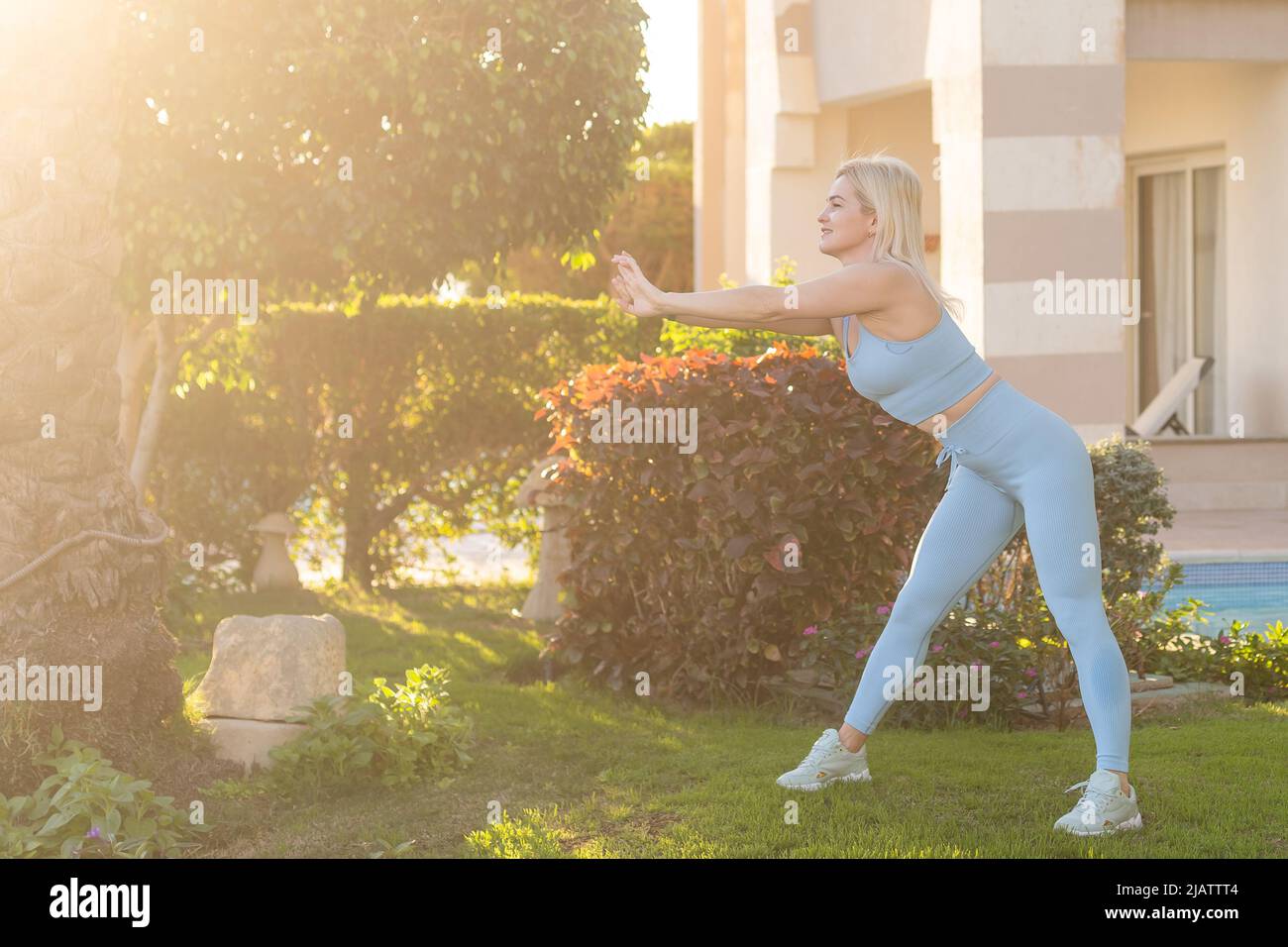 Good morning with yoga meditating on sunrise background. Active woman ...