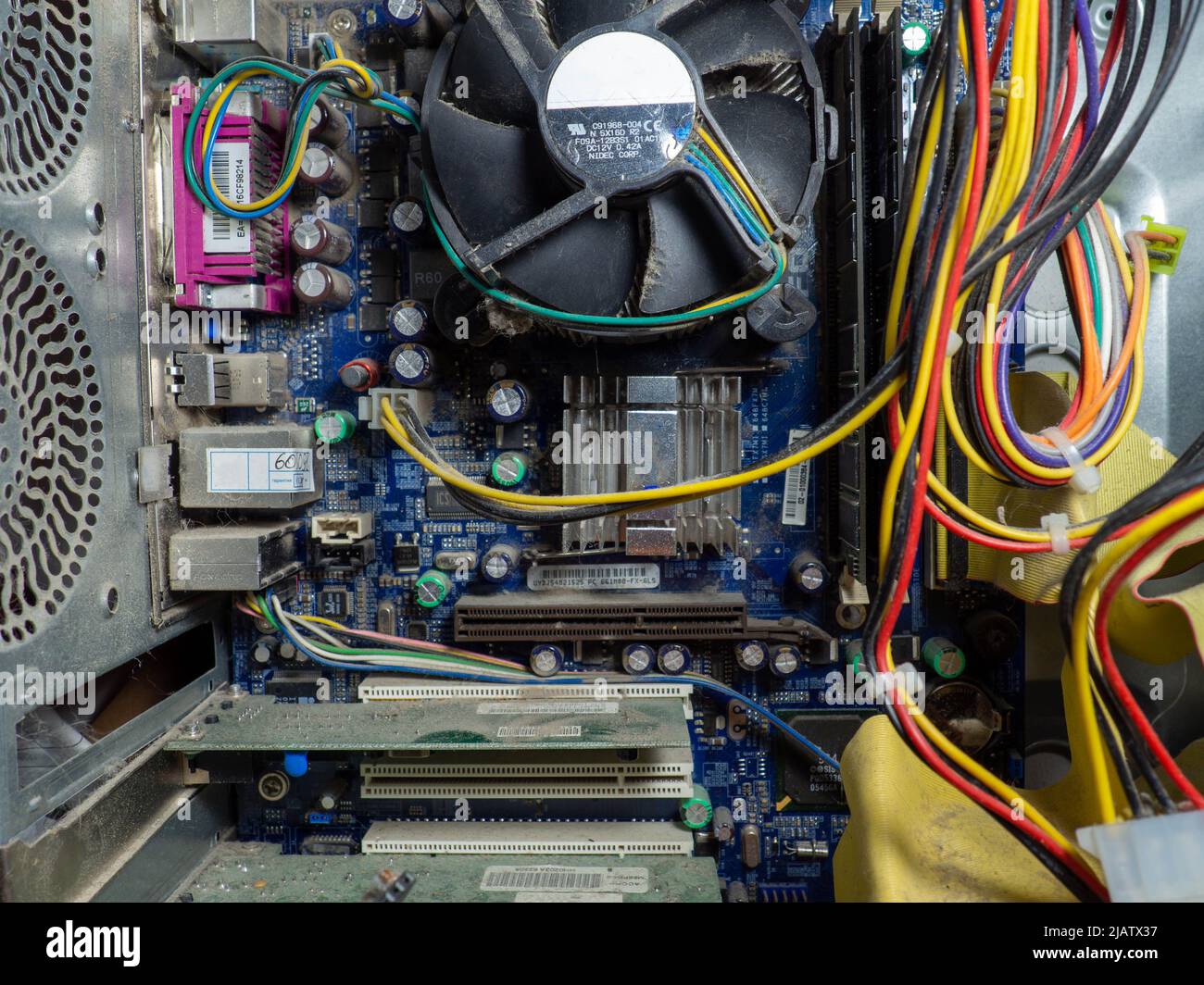 Opened old computer. The stuffing of an old computer is in the dust ...