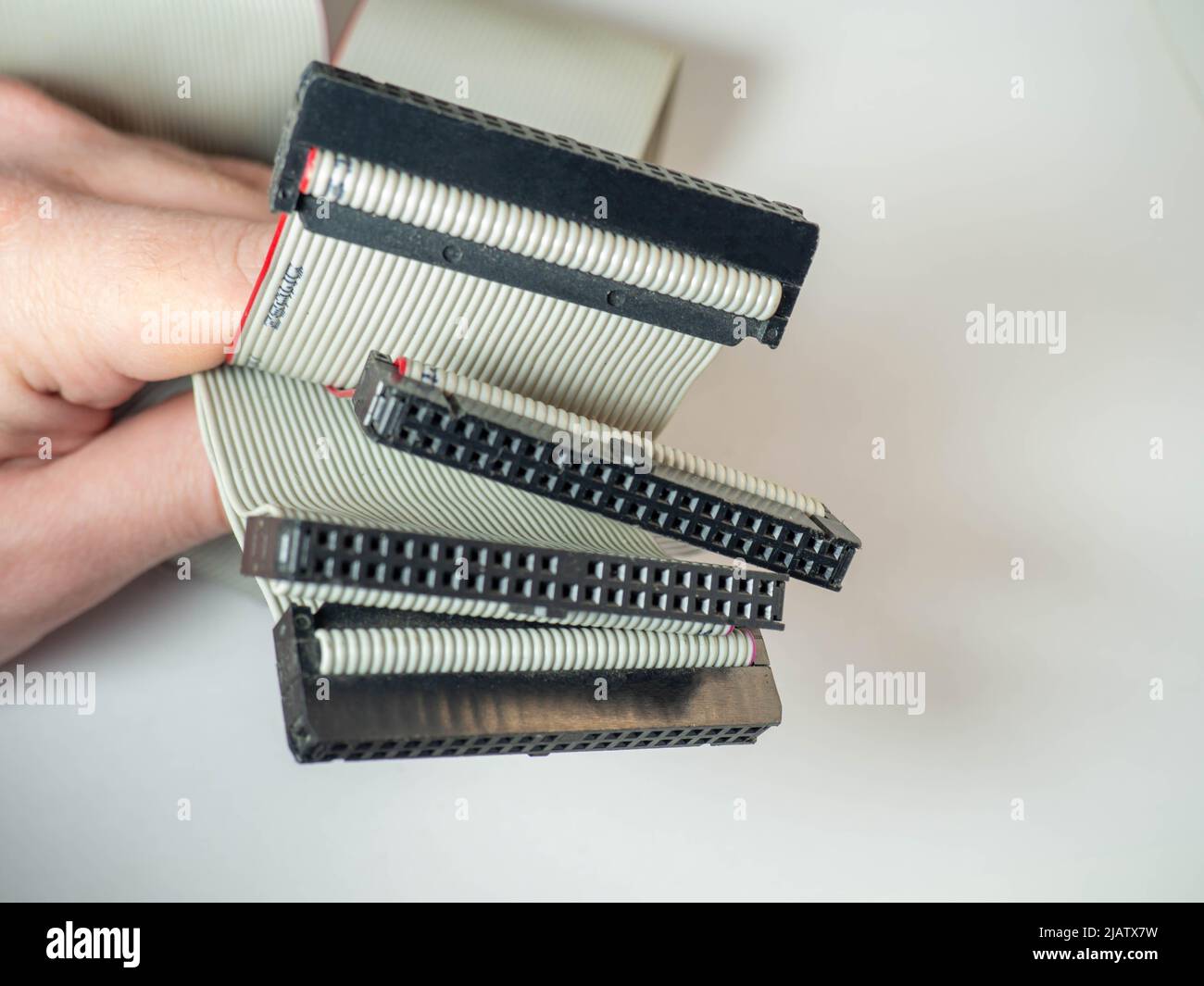 Loops of wires from the computer system unit in the hand. Electronics ...