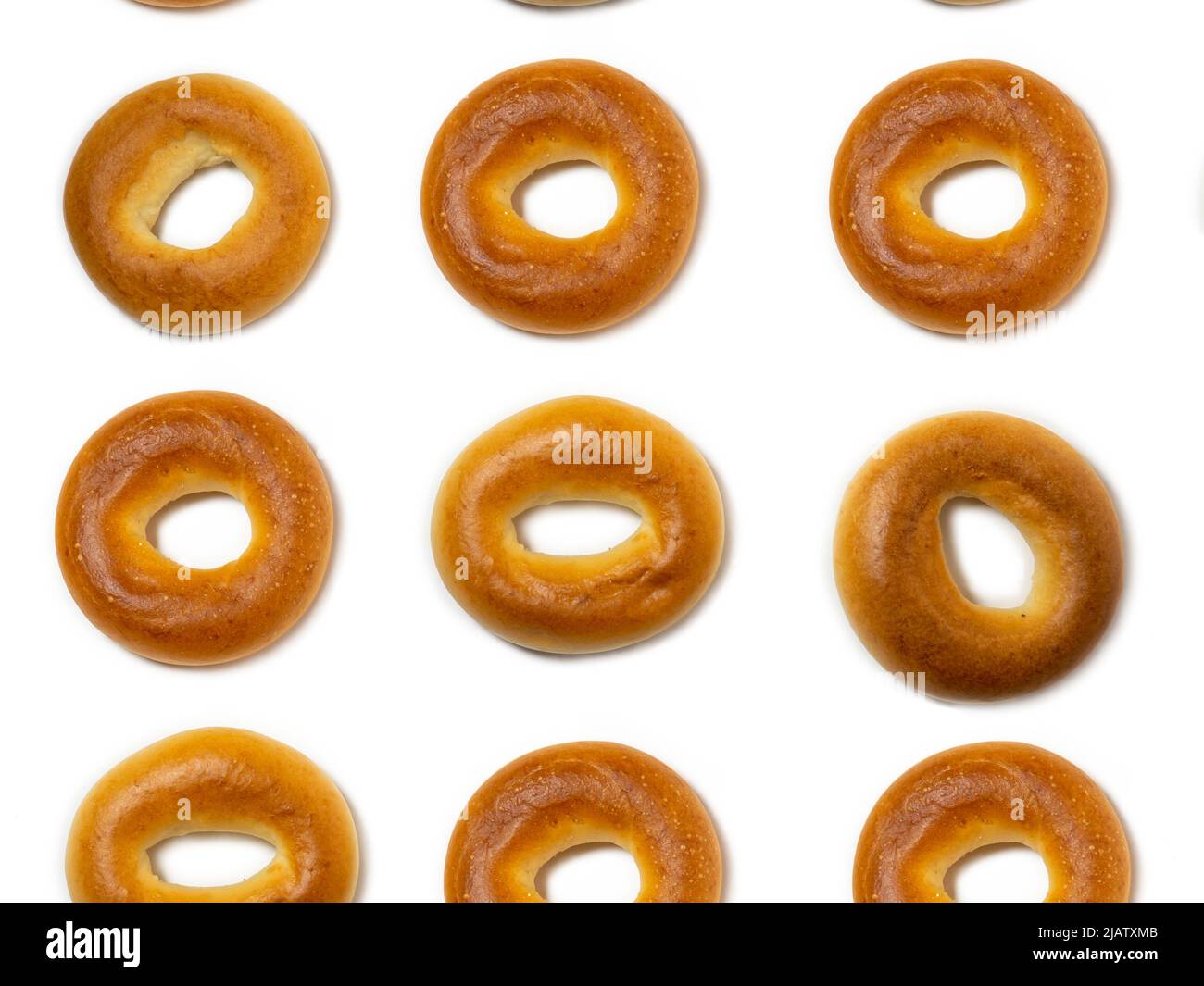 A round bakery product with a hole. Baking background. Buns background ...