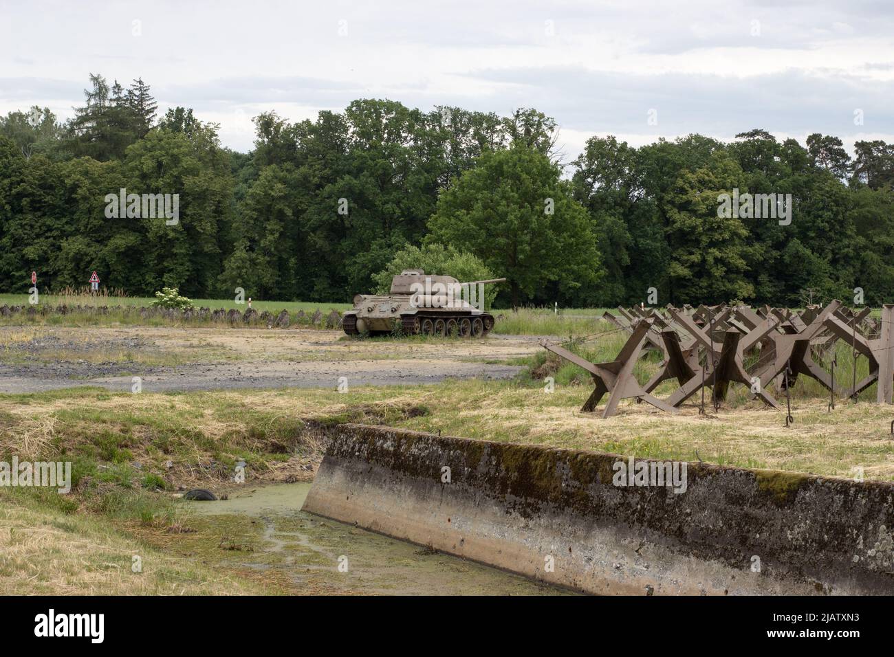 Historic tank from World War II and anti-tank barrier in nature Stock ...