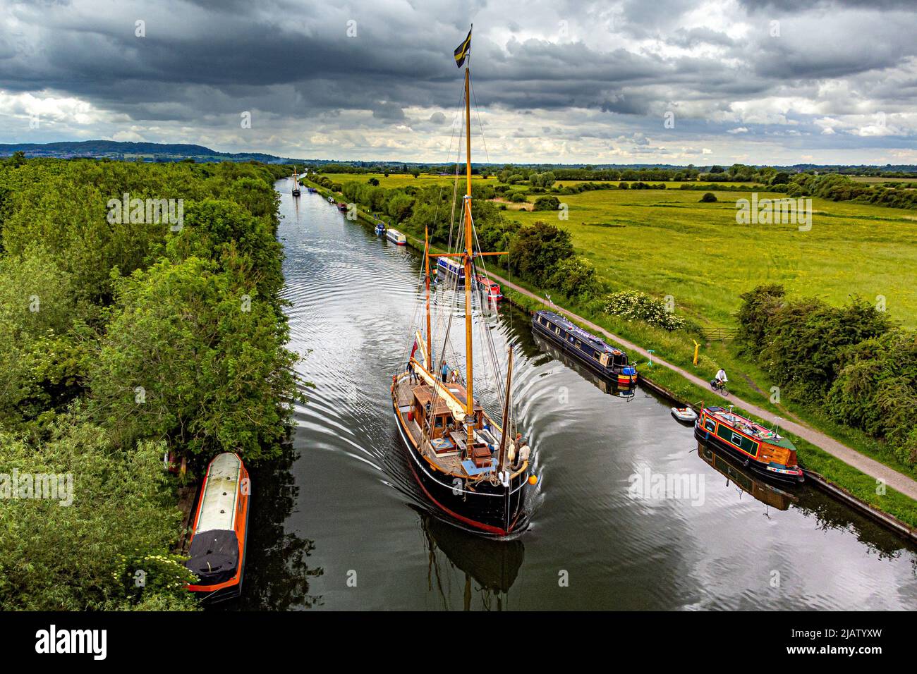 Tall ships travel along the Gloucester & Sharpness Canal, on route to the Gloucester Tall Ships ...