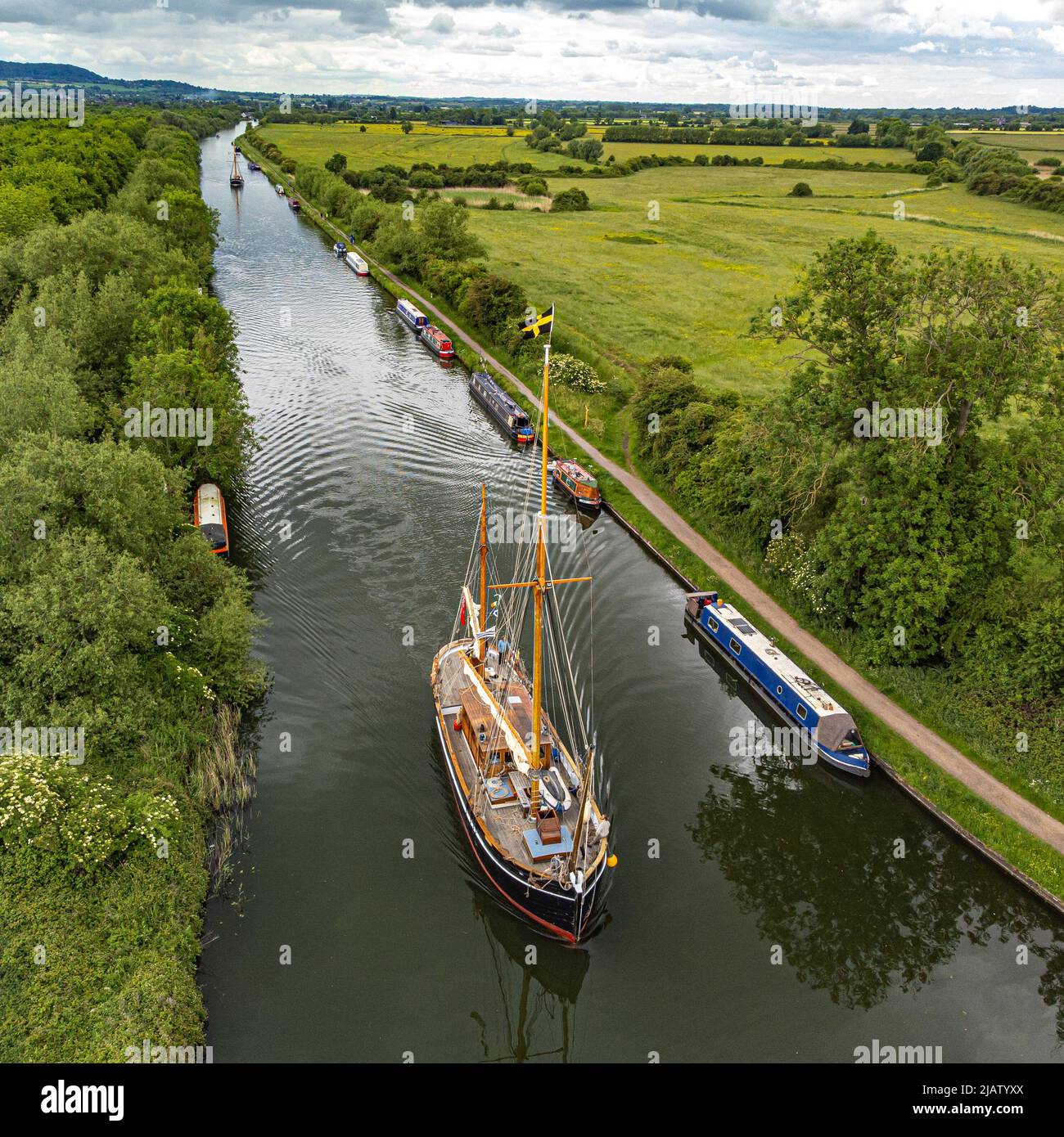 Tall ships travel along the Gloucester & Sharpness Canal, on route to the Gloucester Tall Ships ...