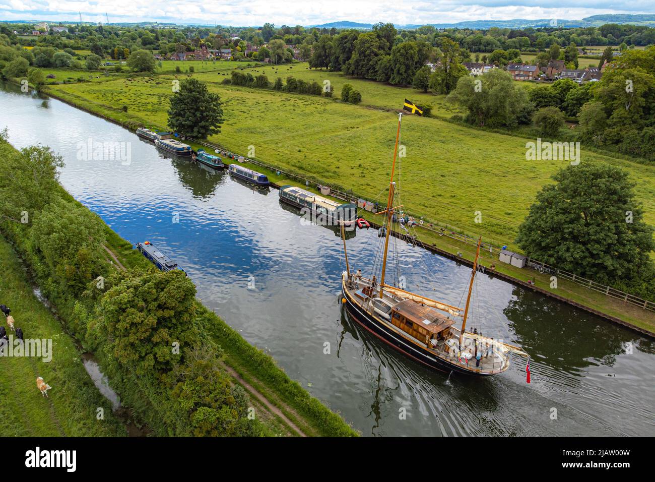 Tall ships travel along the Gloucester & Sharpness Canal, on route to the Gloucester Tall Ships ...