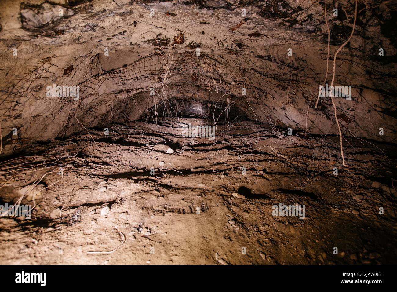 Dark dirty collapsed mine tunnel Stock Photo - Alamy