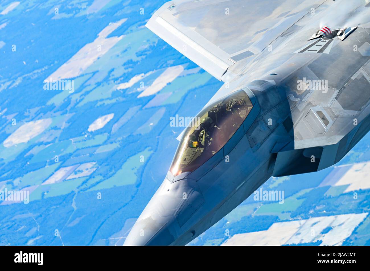 A U.S. Air Force F-22 Raptor with the 325th Fighter Wing, approaches a ...