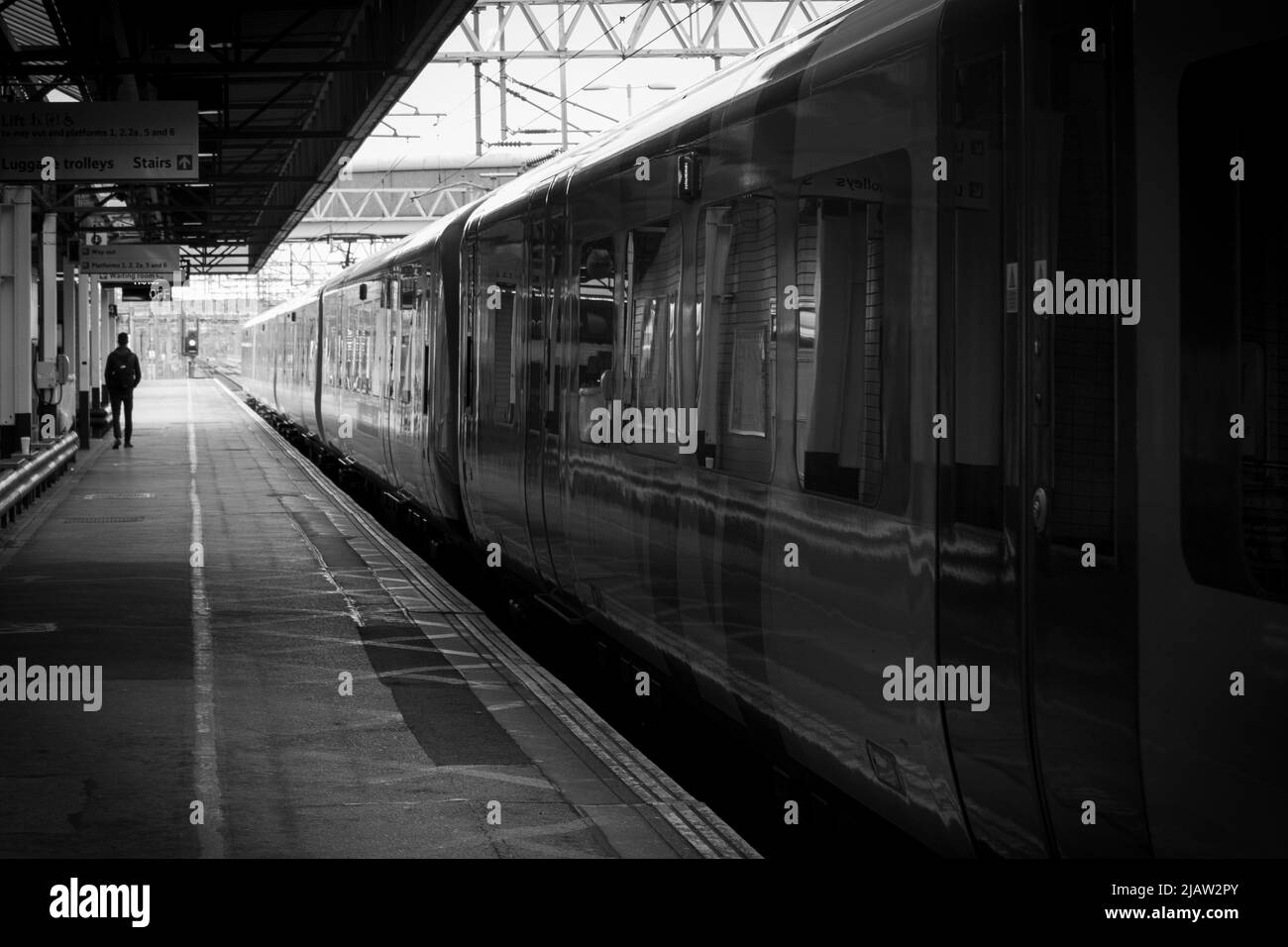 Train pulling into station Stock Photo - Alamy