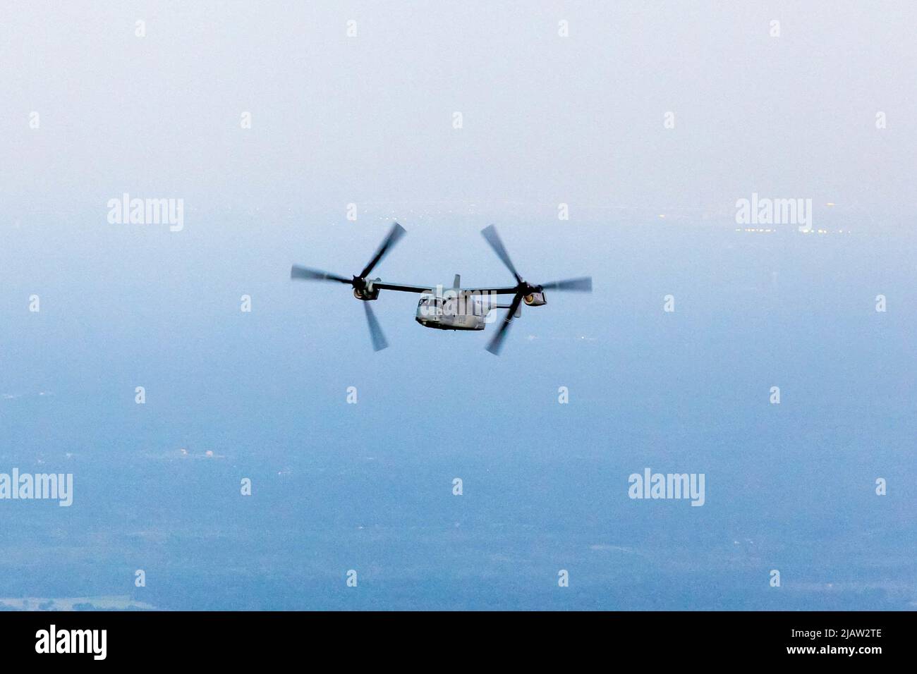 U.S. Marines with Marine Medium Tiltrotor Squadron (VMM) 365 fly an MV ...
