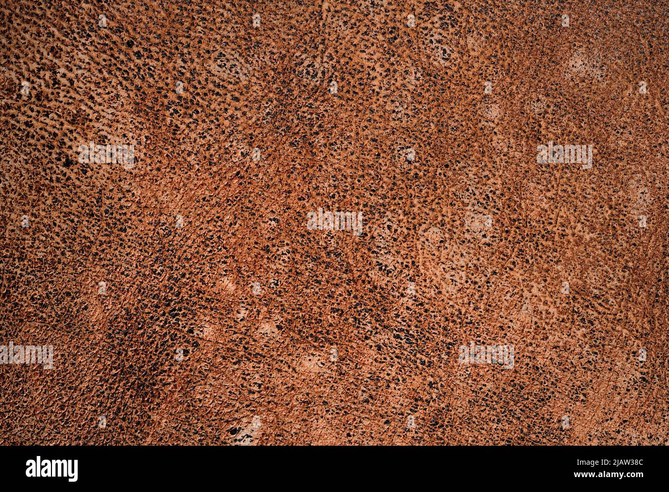 Weathered beige leather surface close up for texture and background ...