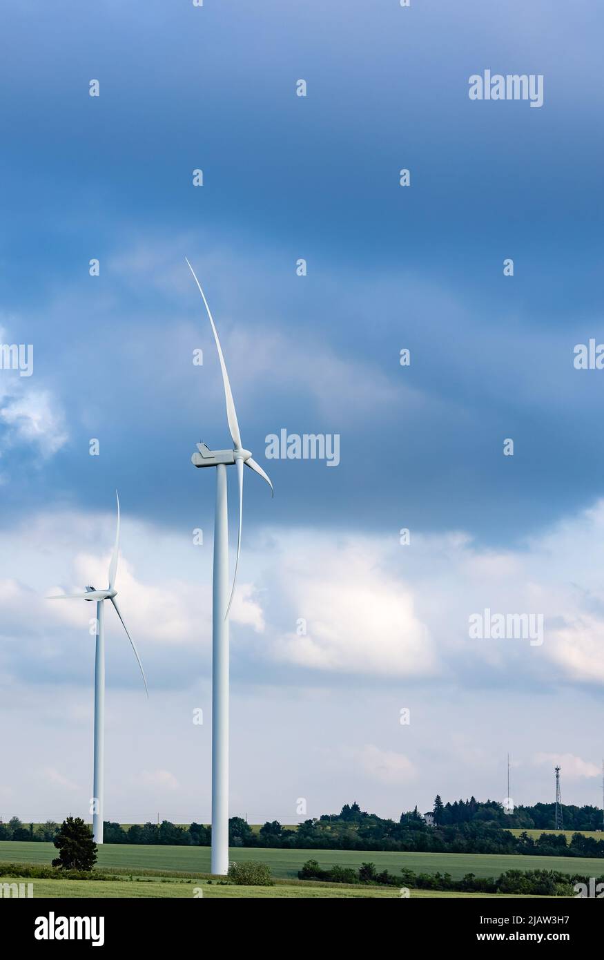 Wind turbines with clouds and blue skies in France near Paris during ...