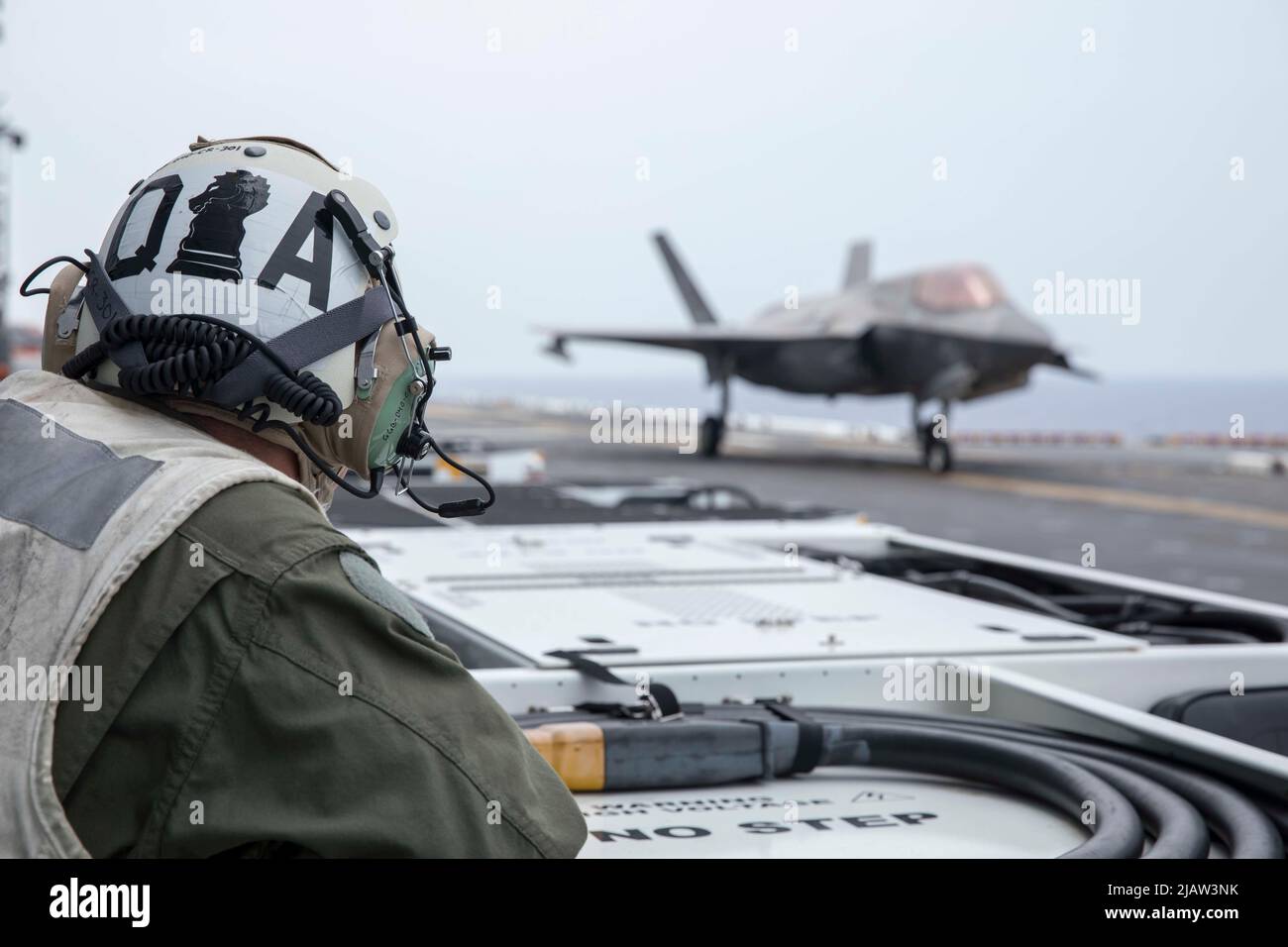 A U.S. Marine with Marine Fighter Attack Squadron (VMFA) 121 observes ...