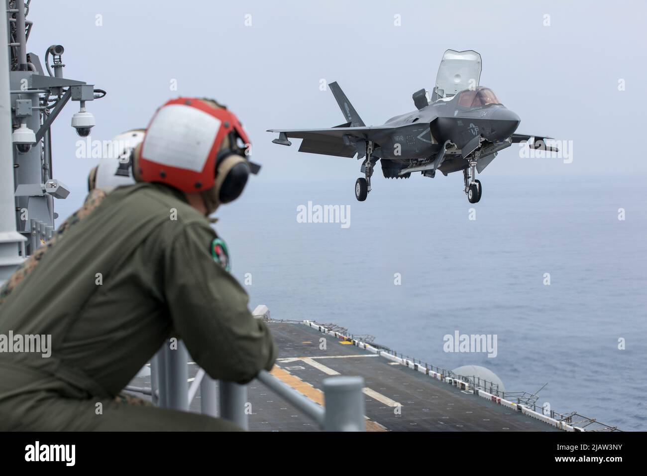 U.S. Marines with Marine Fighter Attack Squadron (VMFA) 121 observe an ...