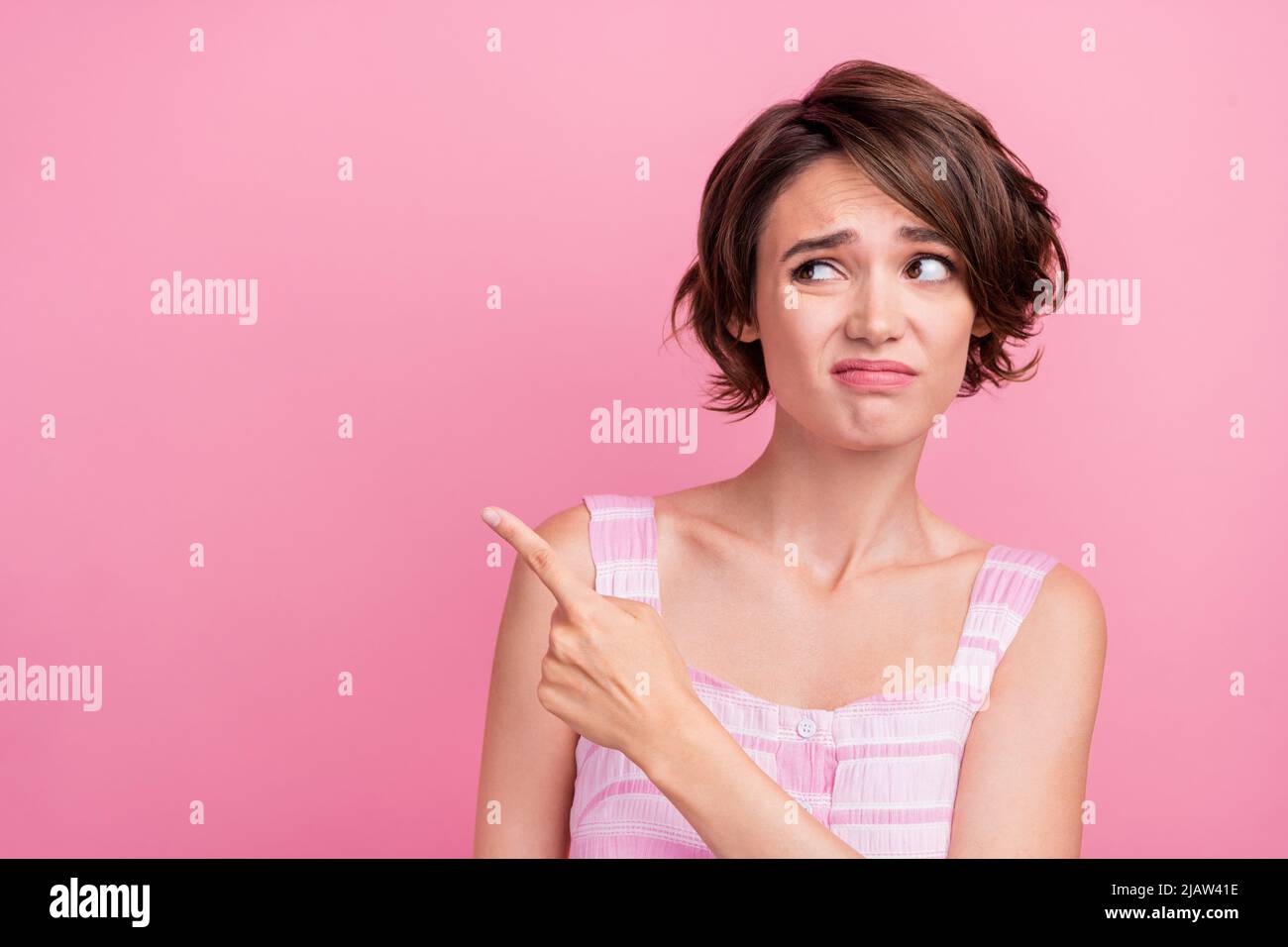 Photo of young displeased girl look point finger empty space negative ...