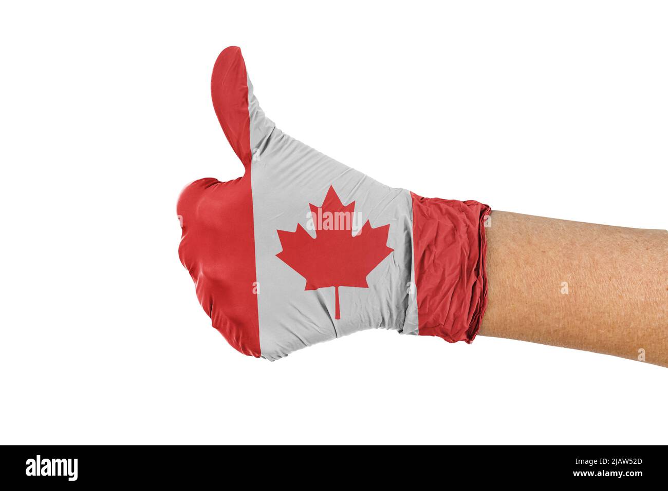 Canada flag on a hand glove showing thumbs up sign Stock Photo - Alamy