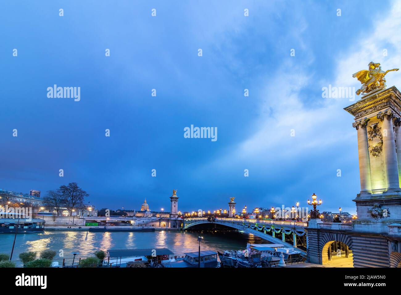 The Pont Alexandre III at night, is a deck arch bridge that spans the ...