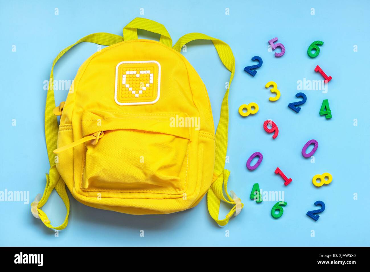 Back to school, education concept. Yellow backpack, numbers isolated on ...