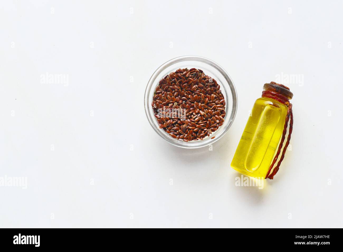 top view of flax seeds and oil on white background Stock Photo - Alamy