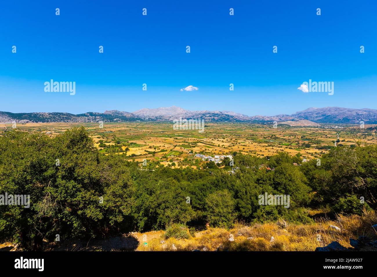 The Crete's Sea and the rocks with field mountain herbs. Blue sky ...