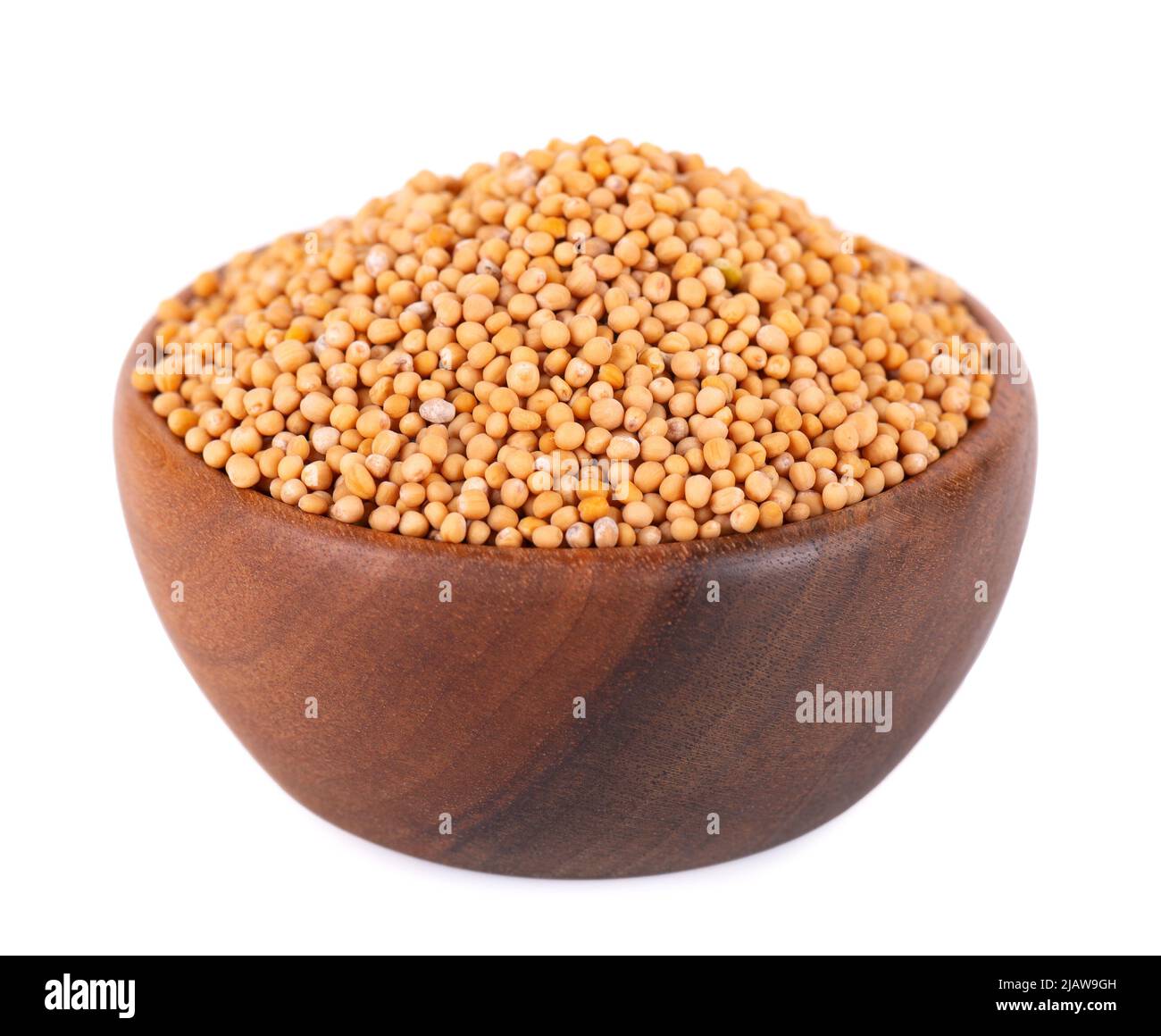 Mustard seeds in wooden bowl, isolated on white background. Pile of dry ...