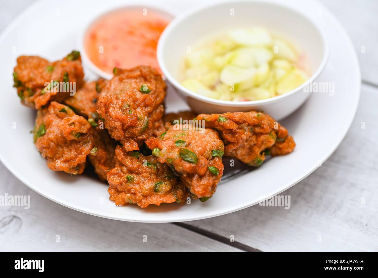 fish cakes on white plate , fried fish paste balls with sauce - Asian ...