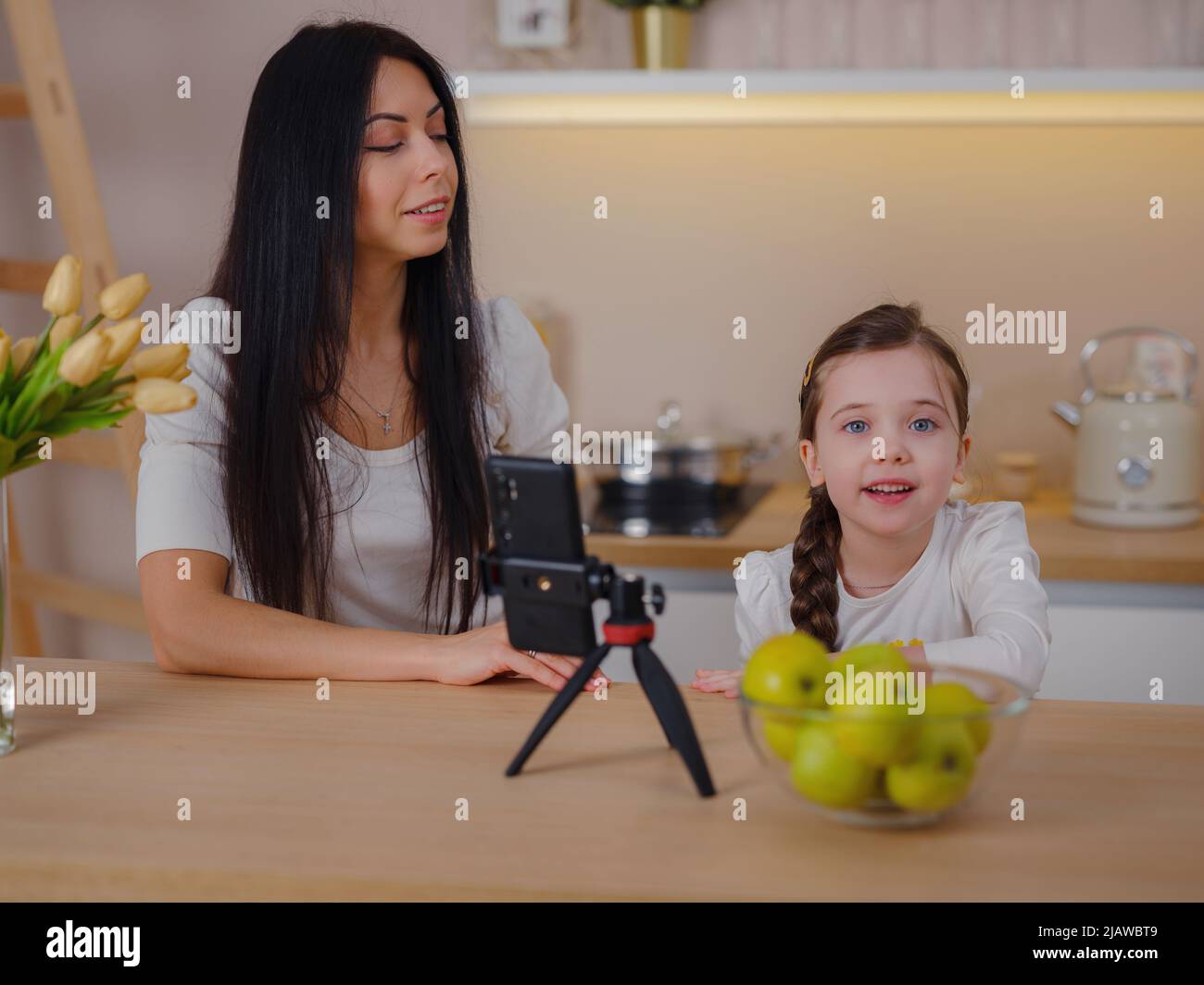 Blogger mom with her baby at home. Millennial Influencer woman creating ...