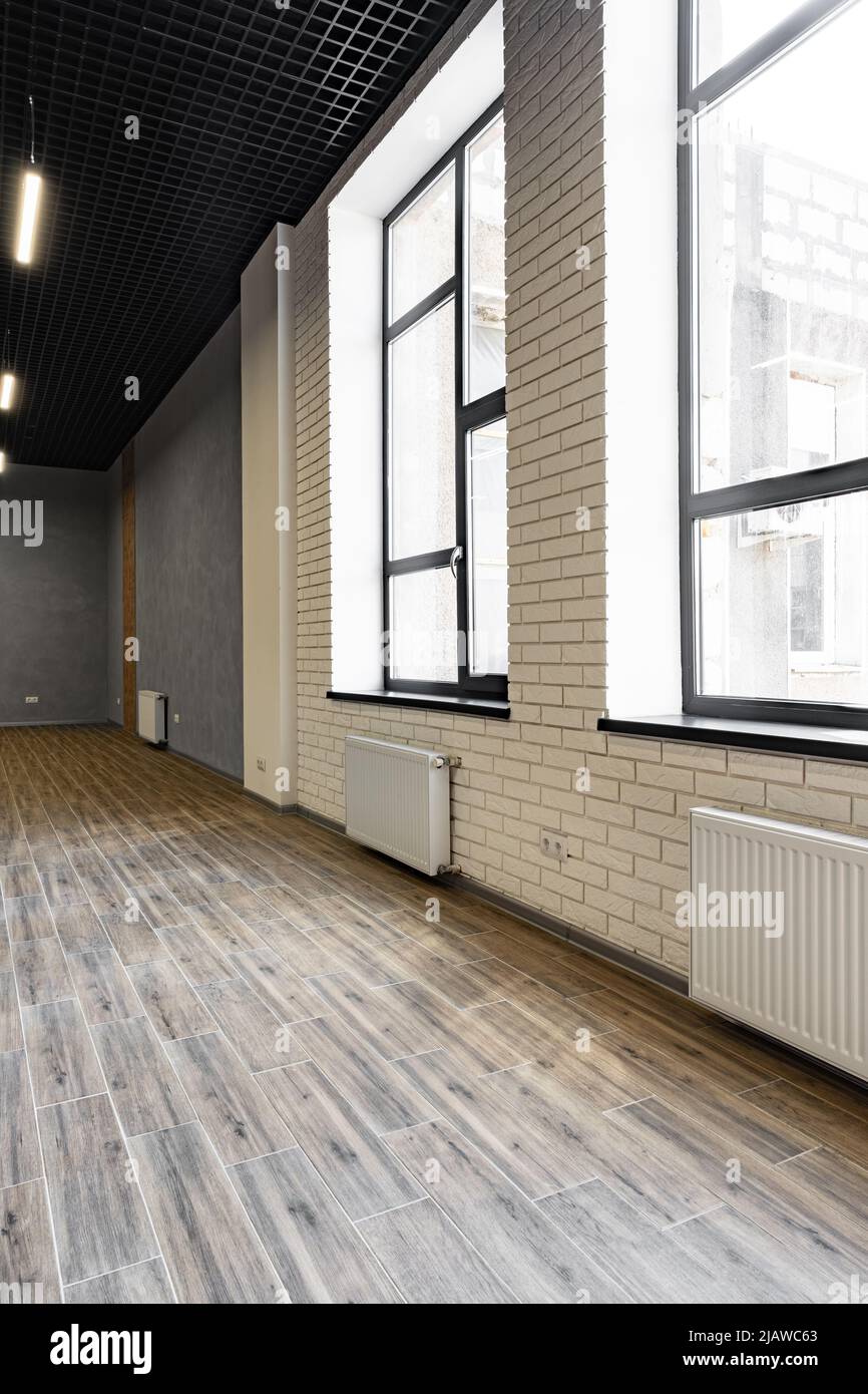 Empty open space office room with window Stock Photo - Alamy