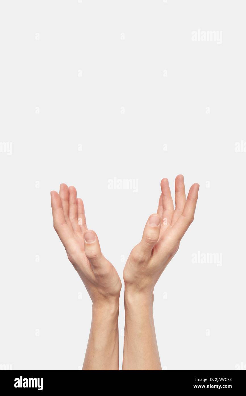 Skinny male hands stretch upwards without manicure on a white ...