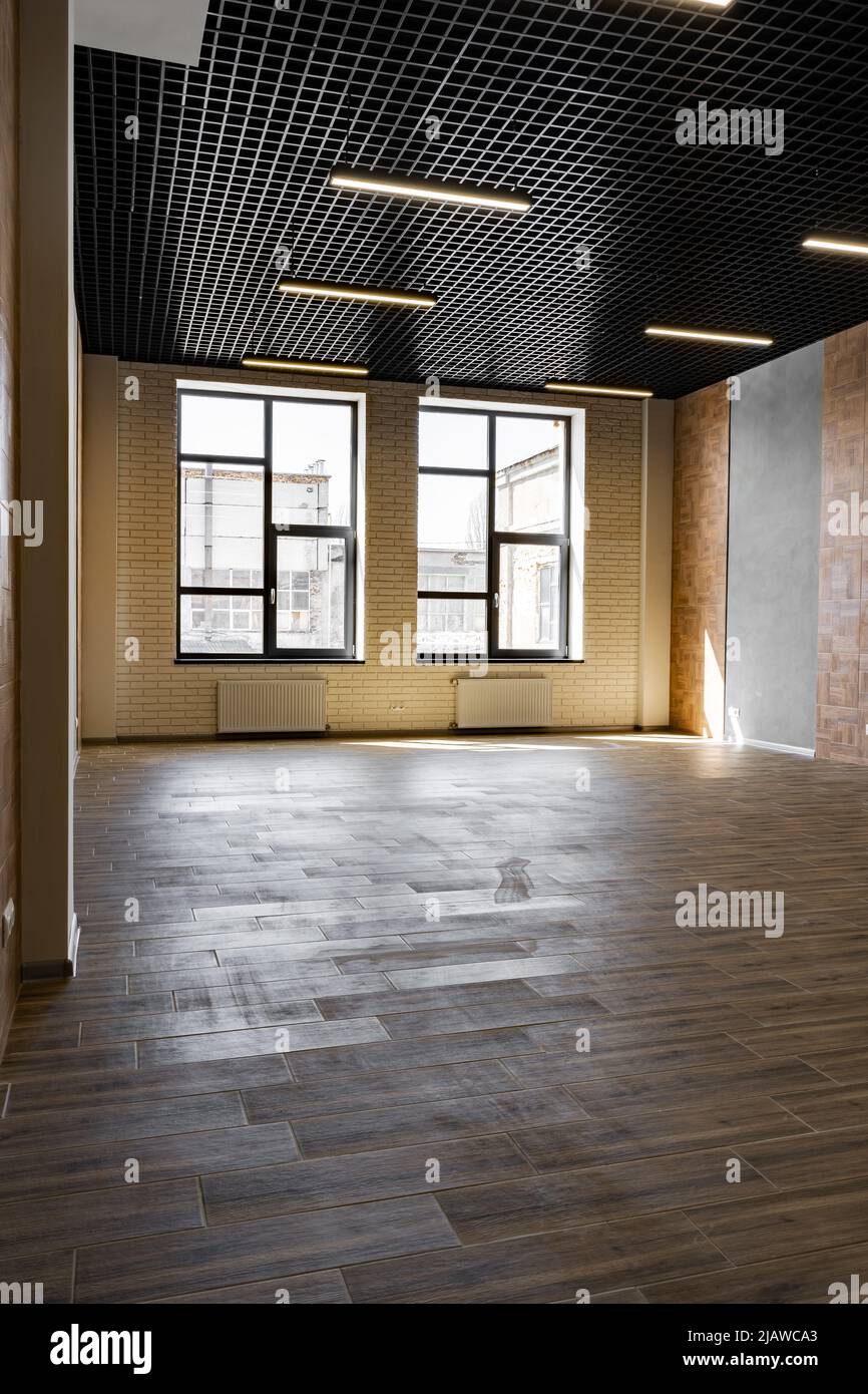 Empty open space office room with window Stock Photo - Alamy