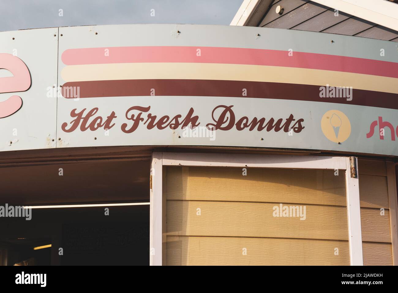 Donut shop store front with retro sign Stock Photo - Alamy
