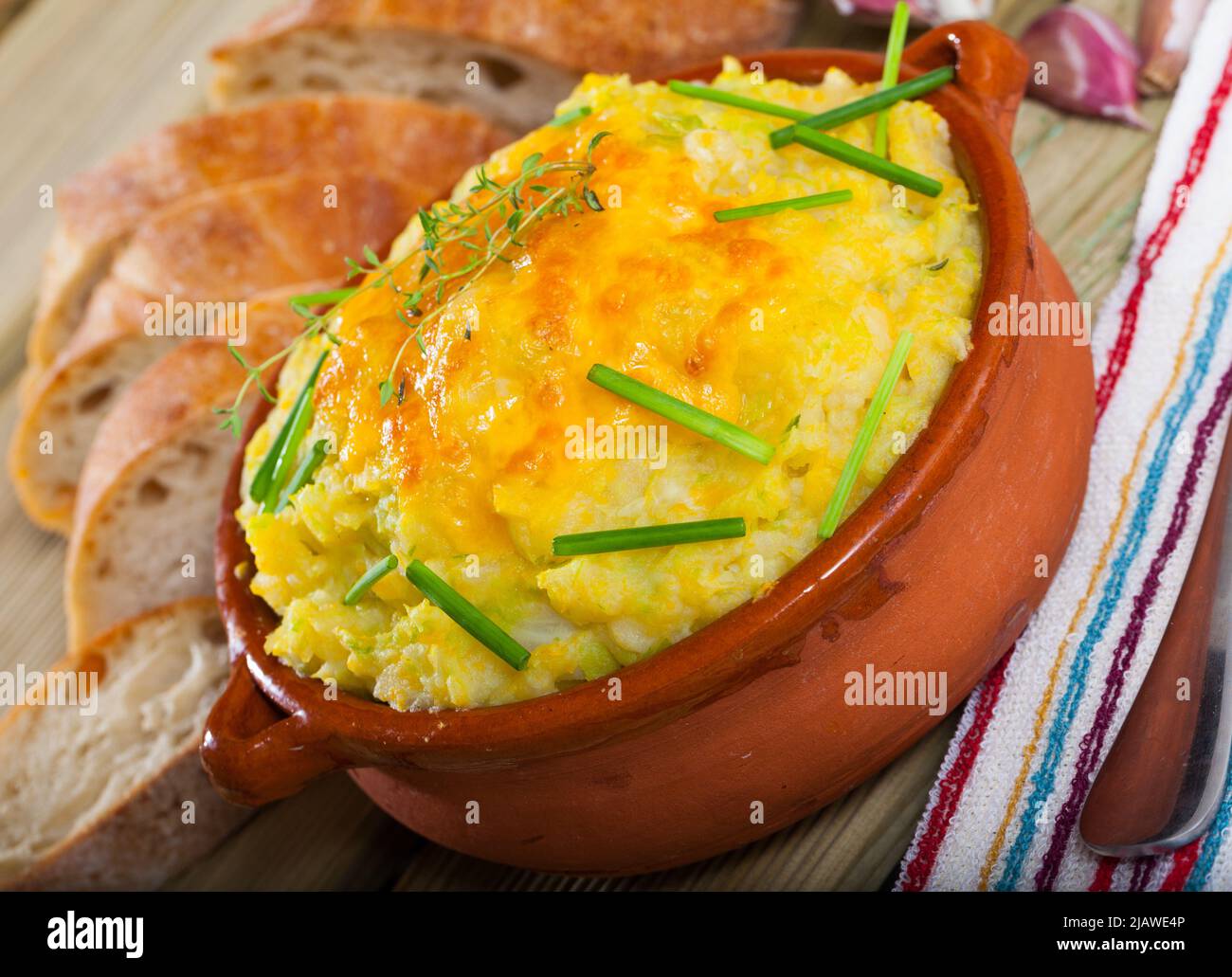 Clay pot of potato casserole Stock Photo - Alamy