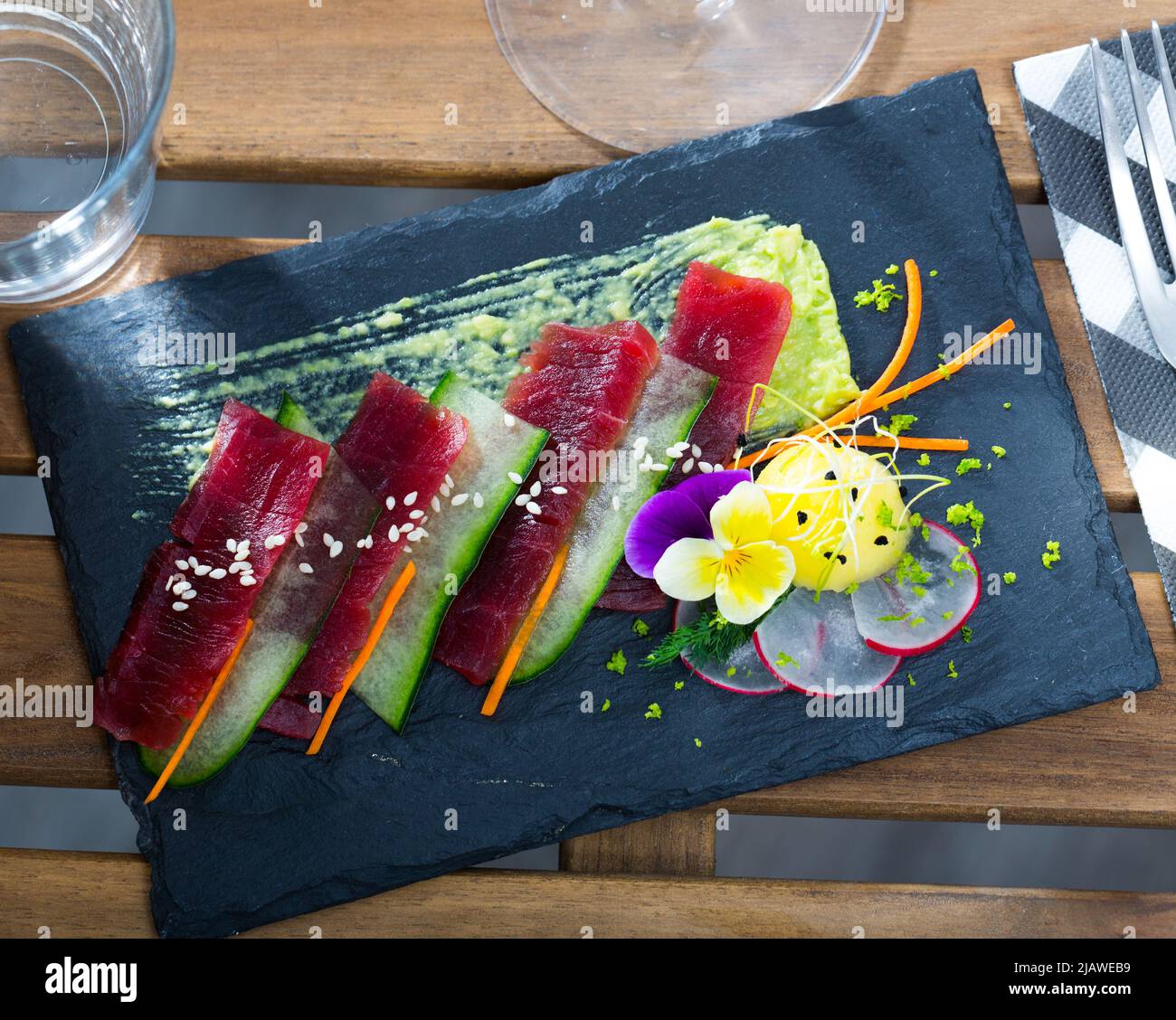 Tuna sashimi with cucumber and avocado sauce Stock Photo - Alamy