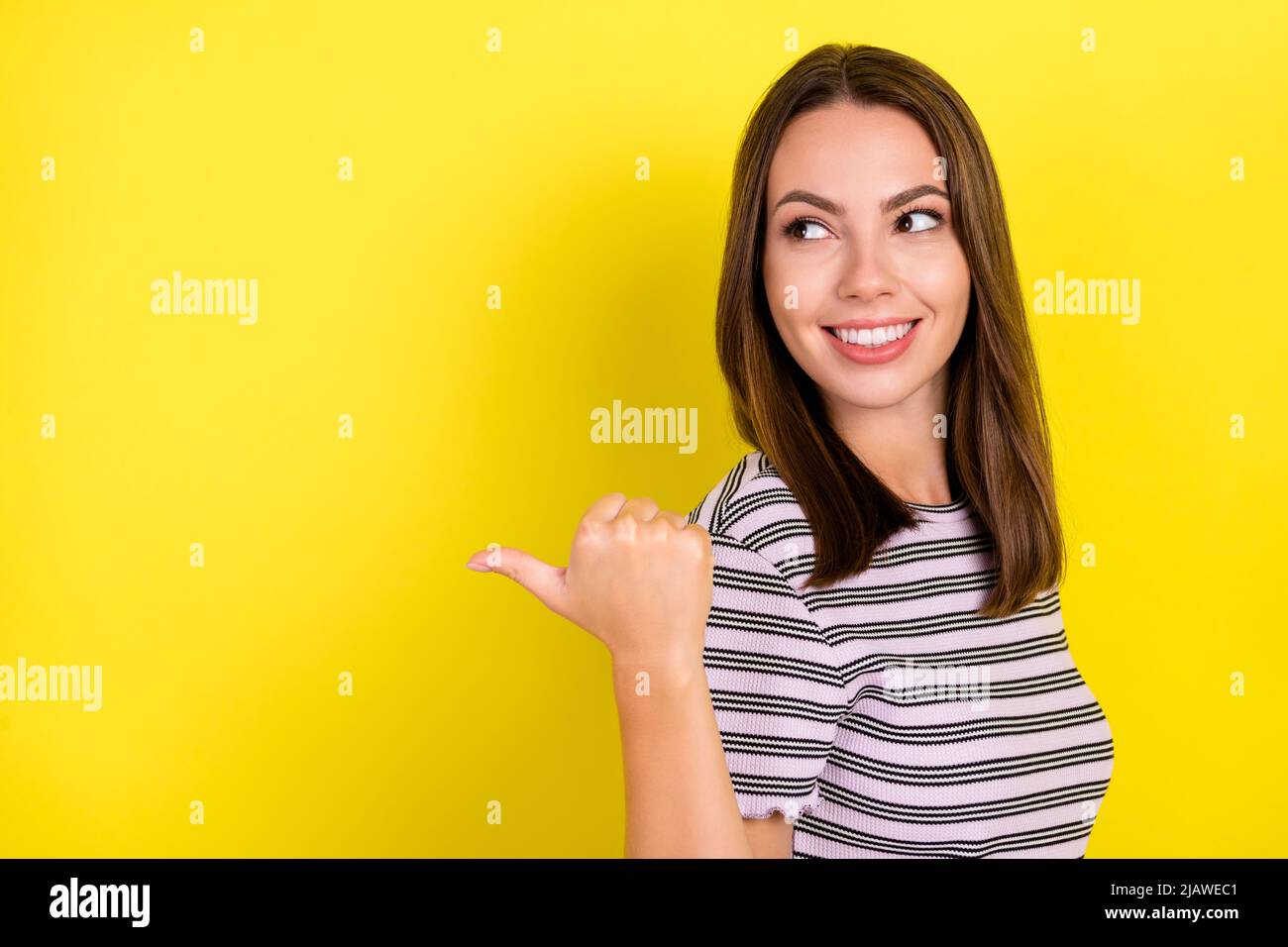 Profile photo of interested young brunette lady point look empty space ...