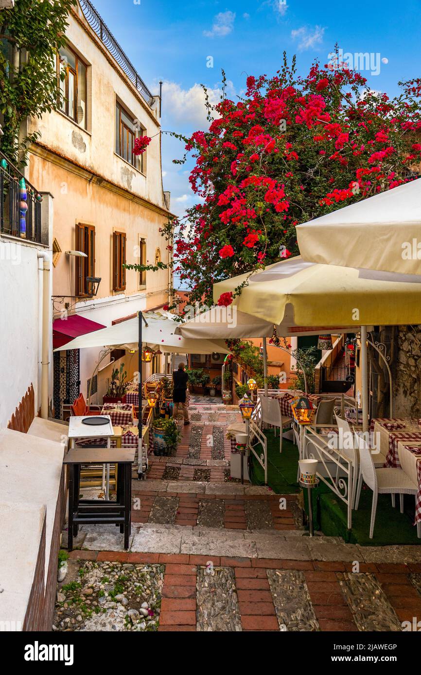Beautiful old town of Taormina with small streets, flowers ...