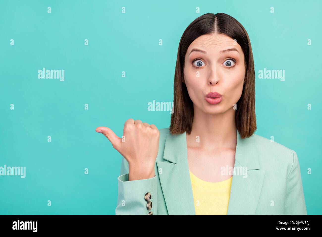Photo Of Impressed Young Brunette Lady Point Empty Space Wear Blazer