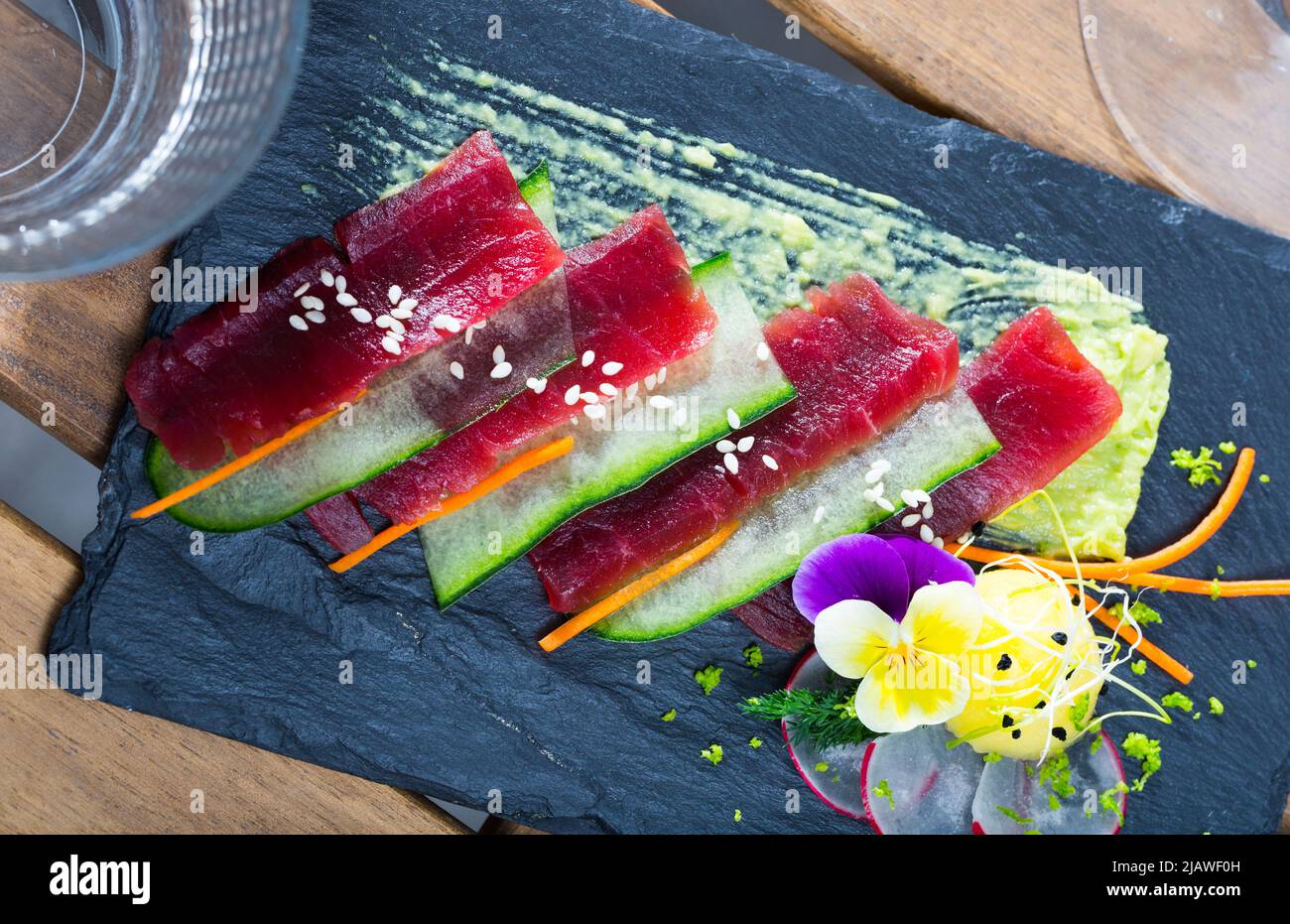 Raw tuna sashimi with cucumber and avocado sauce Stock Photo - Alamy