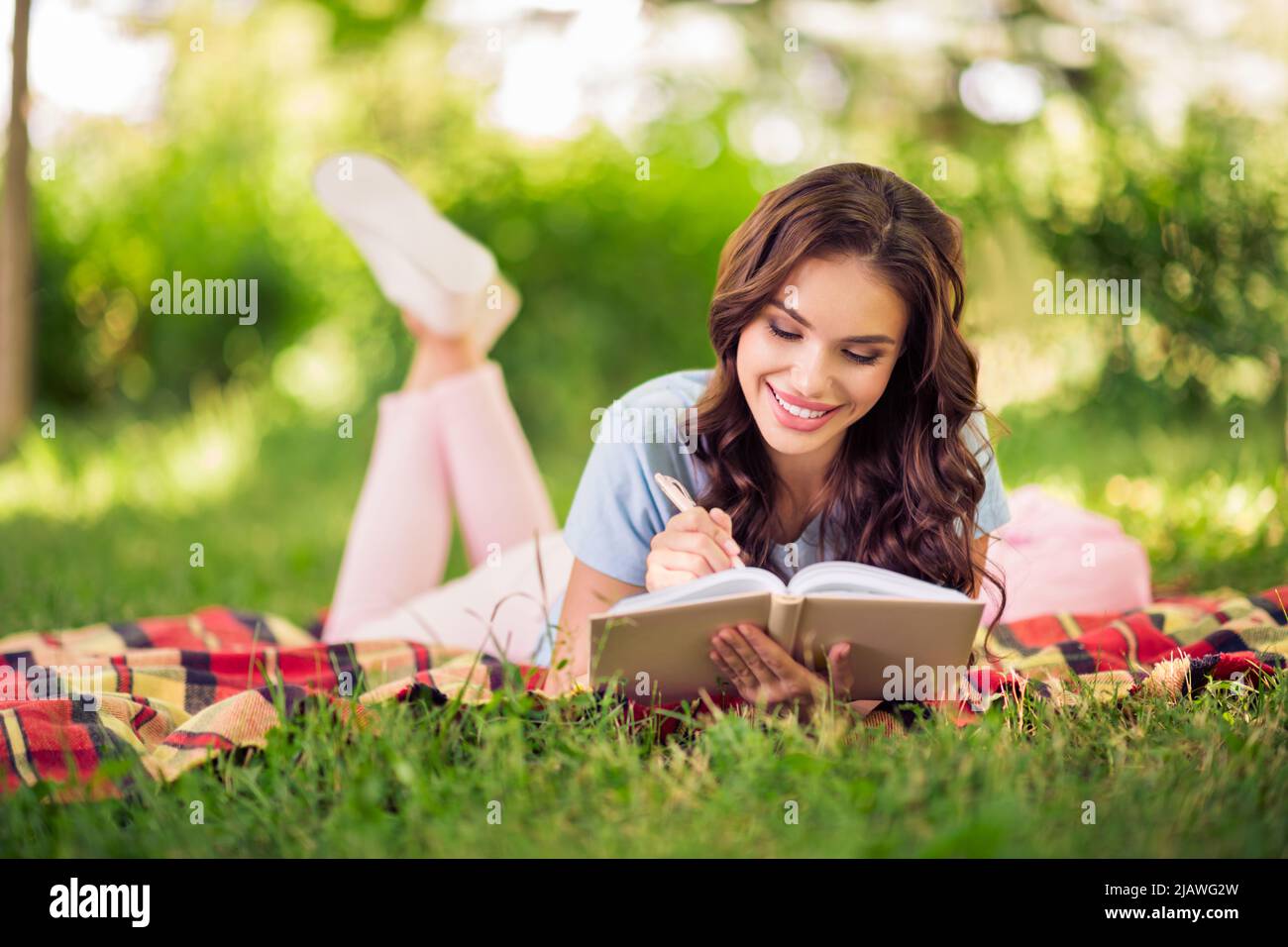 Full length photo of nice pretty focused woman write notebook diary ...
