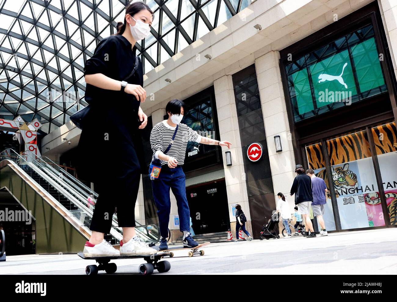 Shanghai, China. 1st June, 2022. Young people play skateboard on a ...