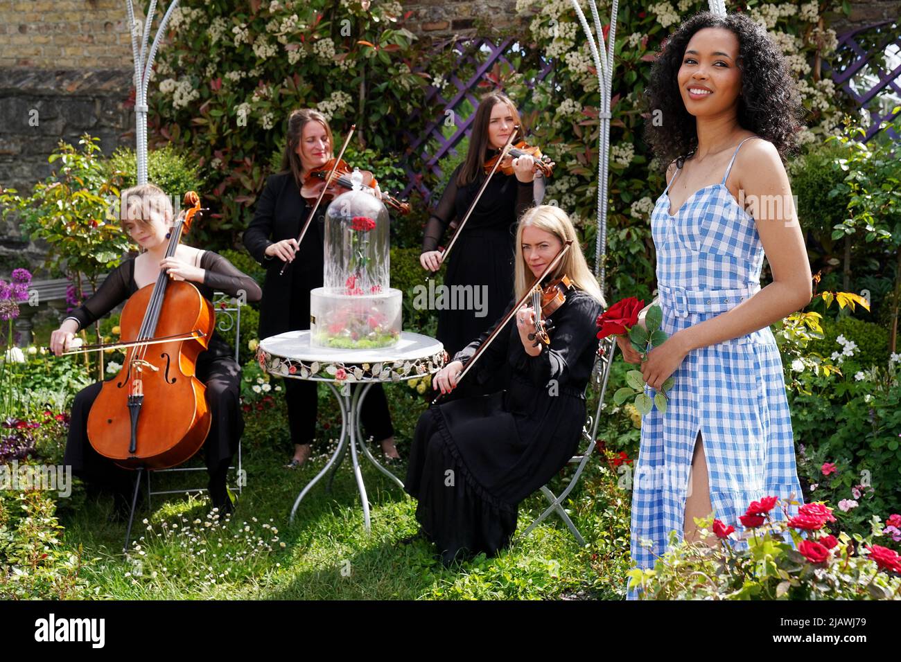 Model Marwa Noelle Ali with the Castle String Quartet in a garden ...