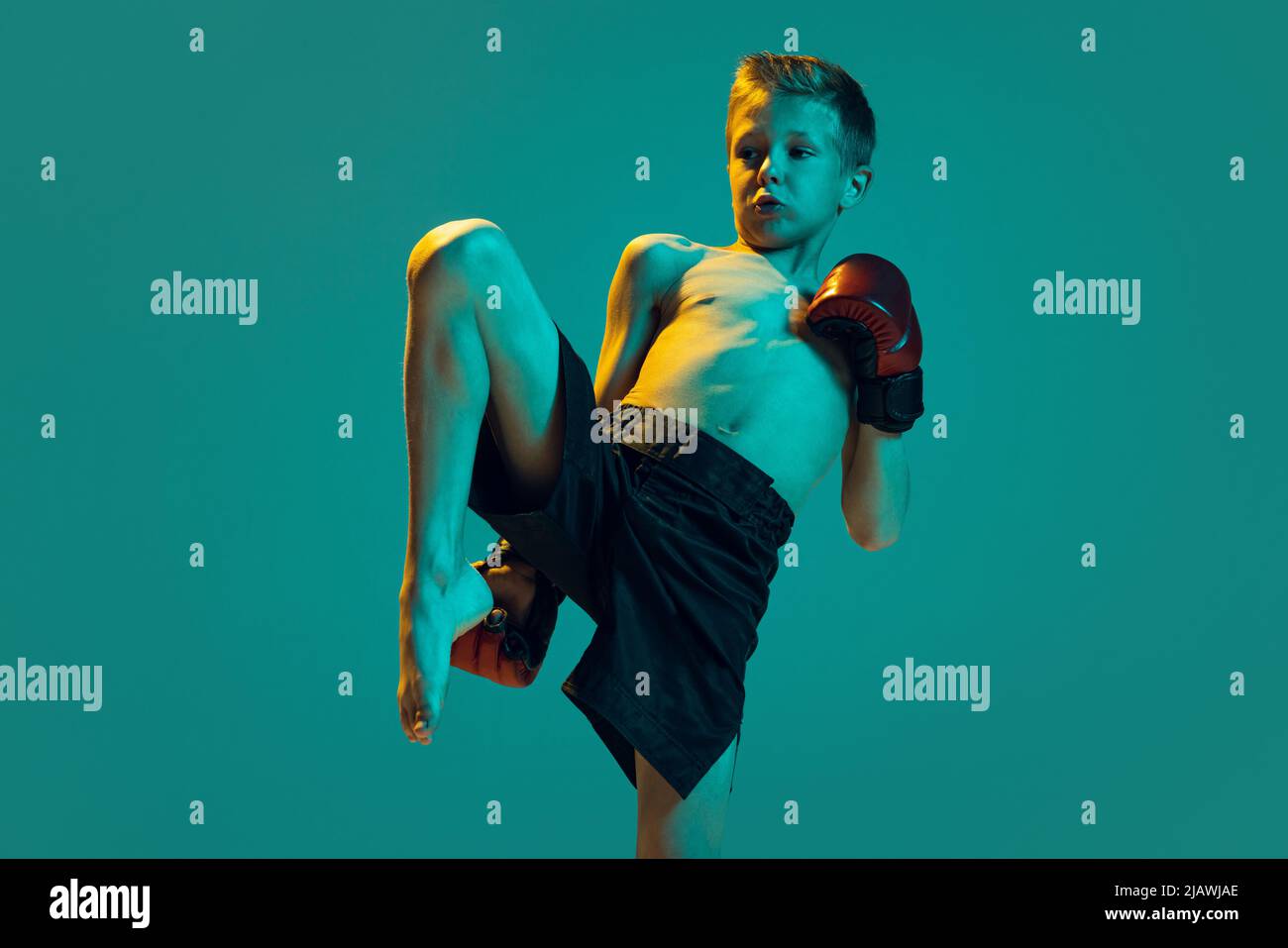 Young sportsmen, beginner fighter of mma sport in action isolated on ...