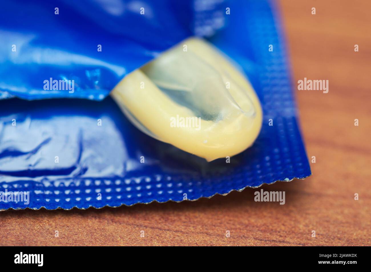 condom sticking out of packet Stock Photo - Alamy