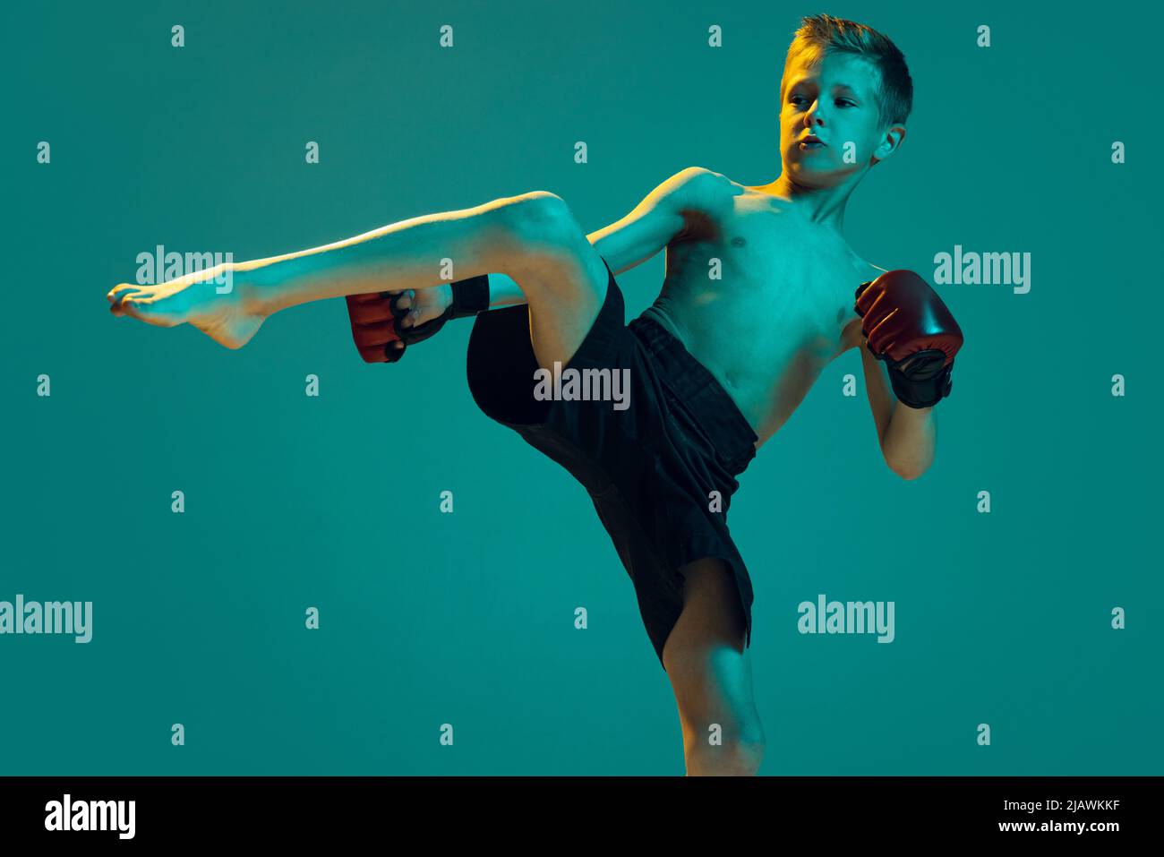 Closeup. Young sportsmen, beginner fighter of mma sport in action ...