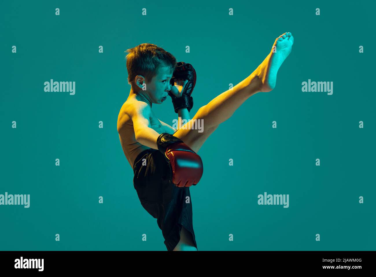Young sportsmen, beginner fighter of mma sport in action isolated on ...