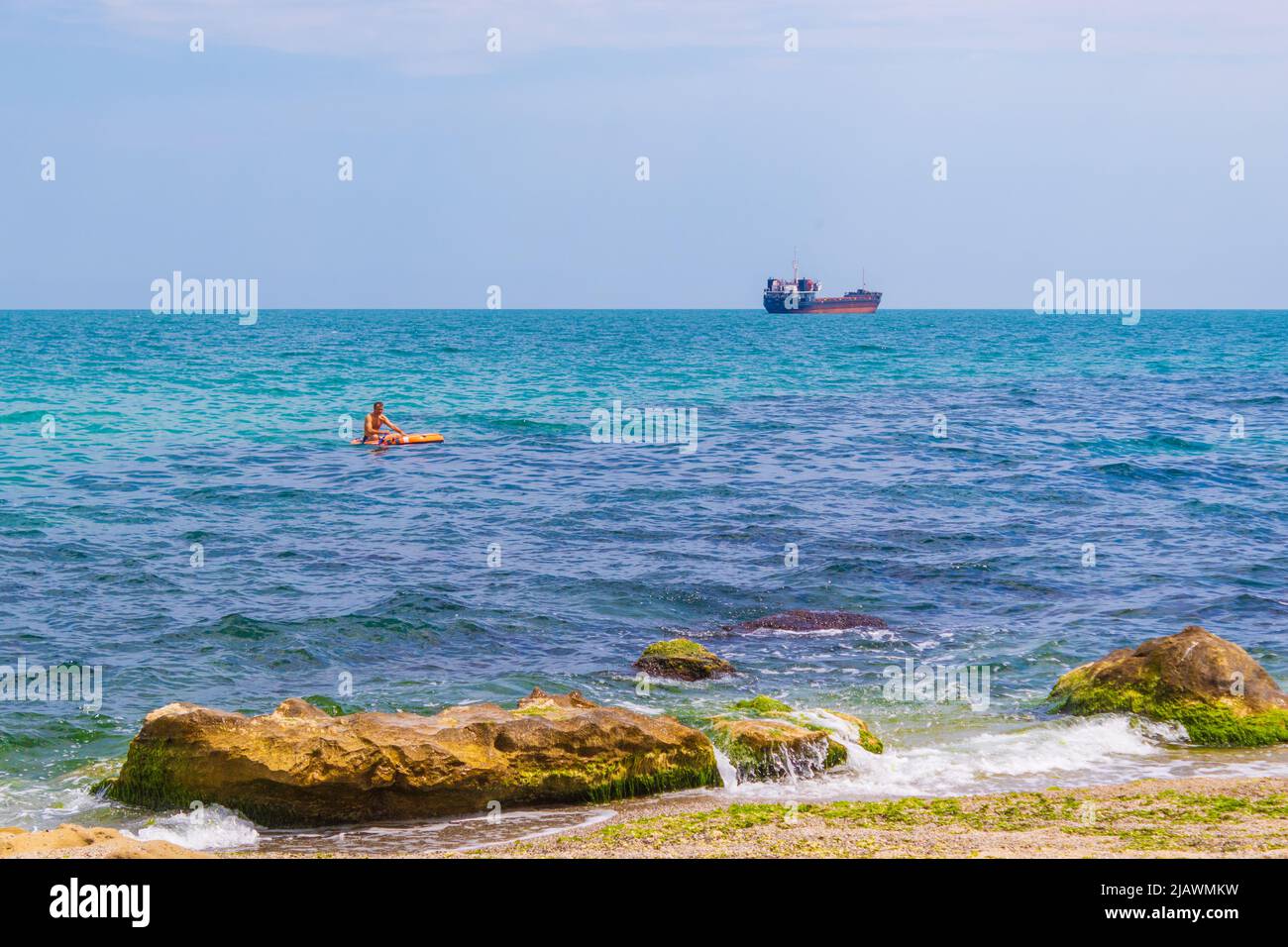 Vacationer man having fun rowing inflatable boat in Black Sea,Varna ...