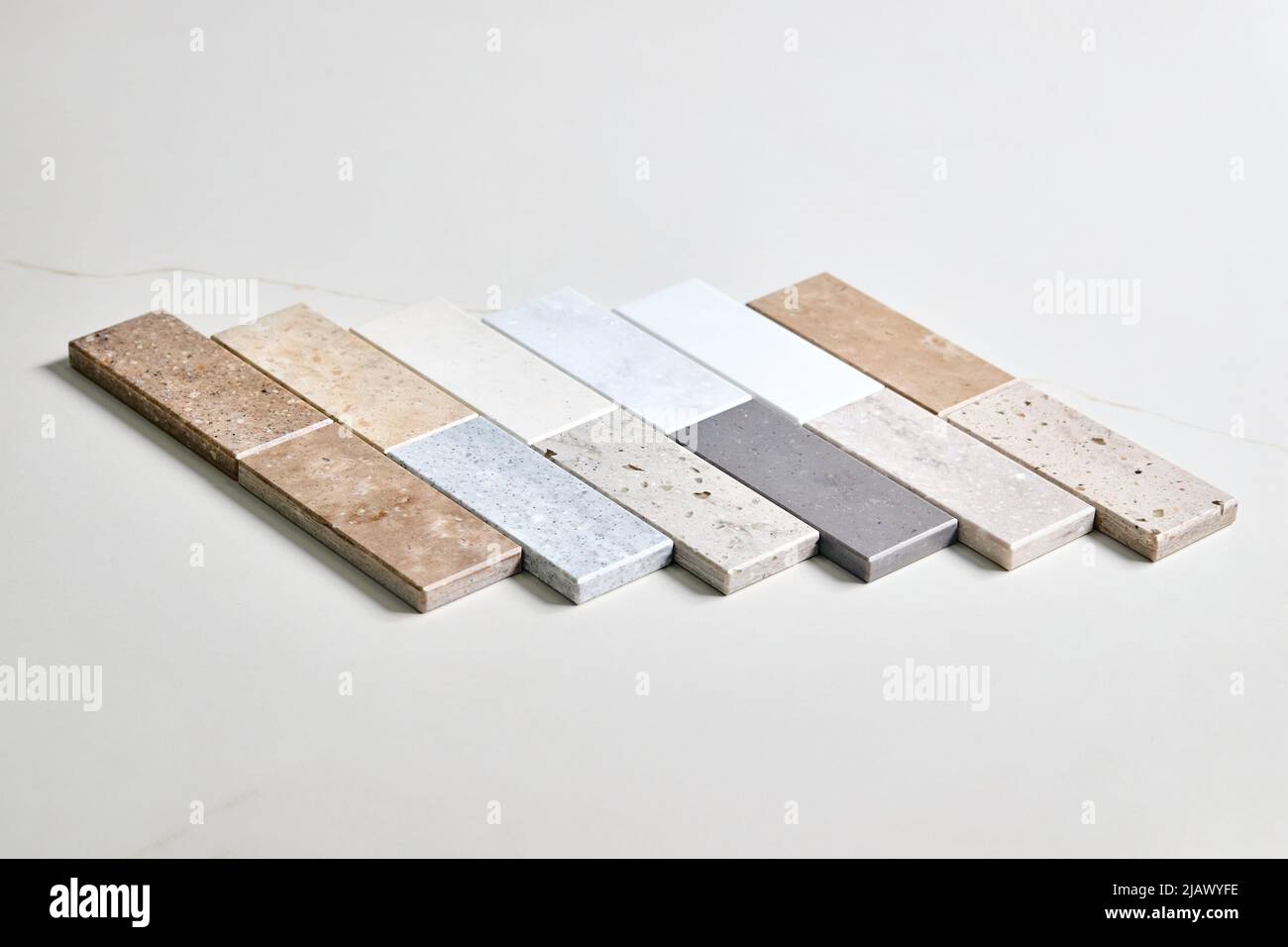 Porcelain ceramic stoneware samples laid on kitchen stoneware table as ...