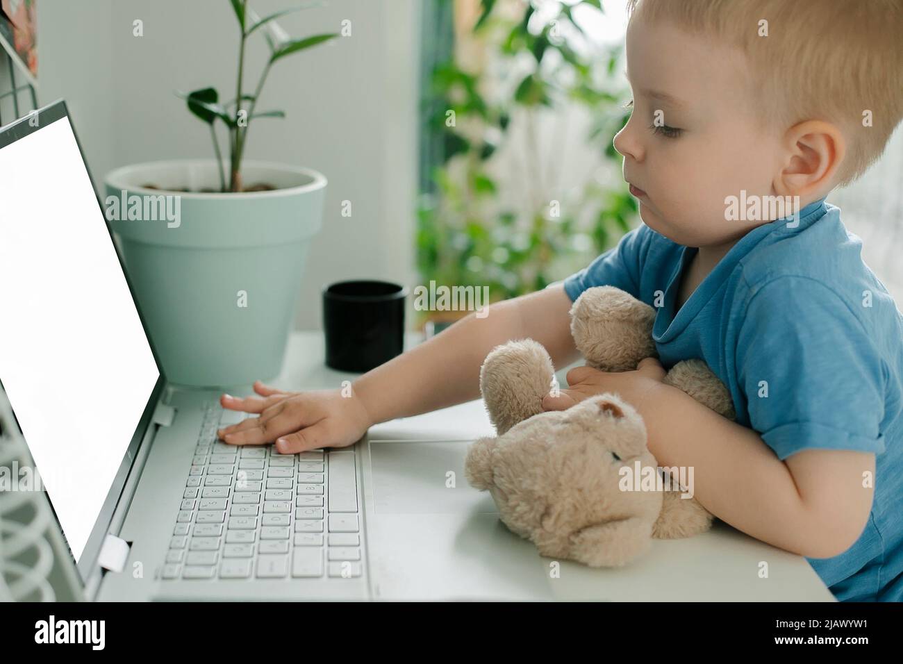 Little toddler cute boy using laptop pc in bedroom at home. Home family ...