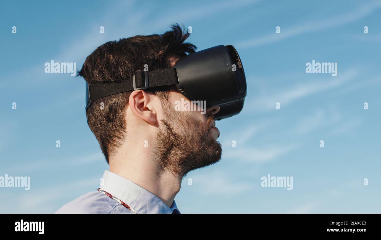 boy looks in the sky with augmented reality viewer Stock Photo - Alamy