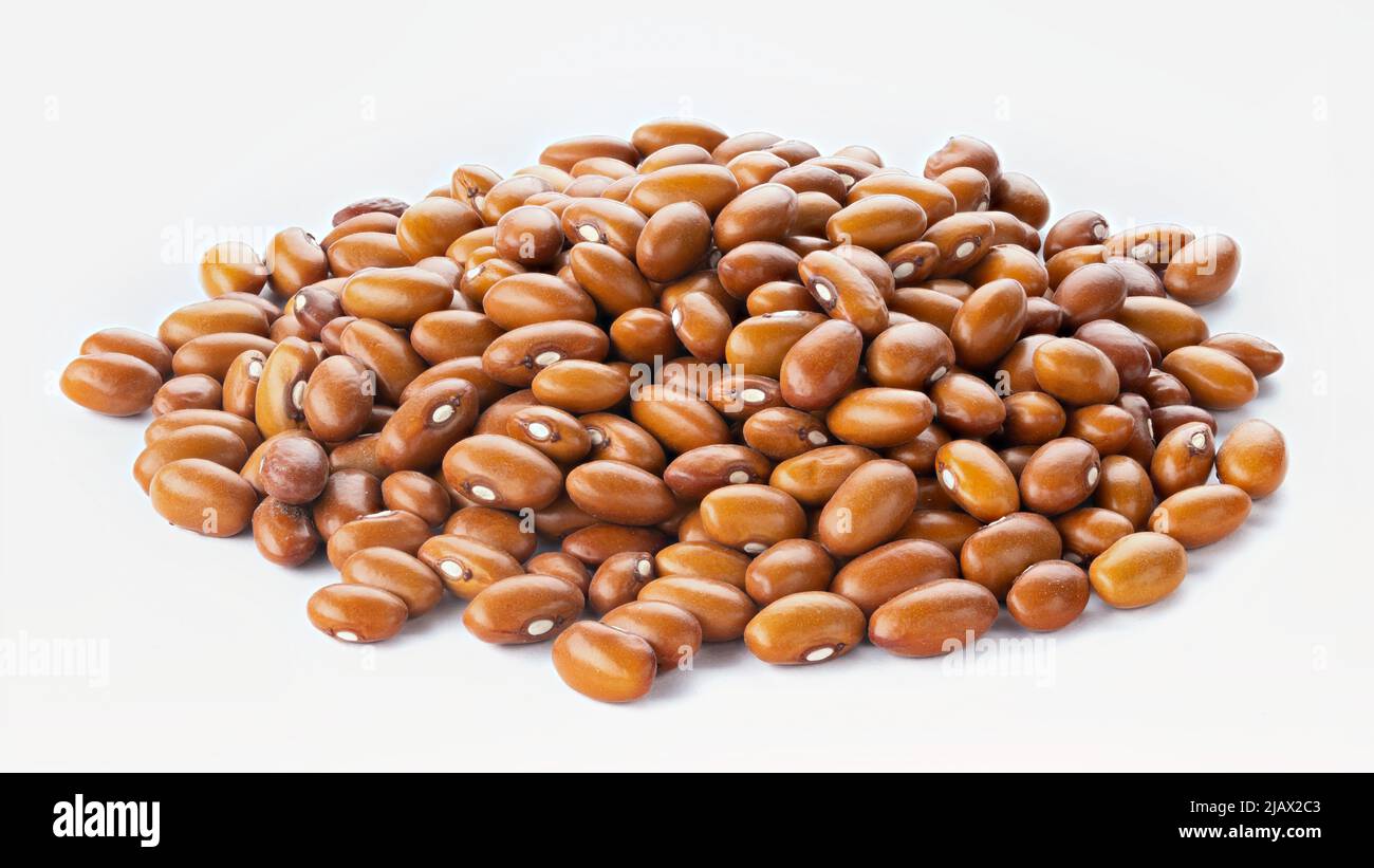 Dried orange beans on a white plate. Healthy food concept Stock Photo ...