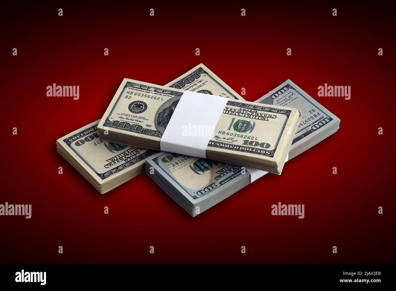 Bundle of US dollar bills on crimson red background. Pack of american ...